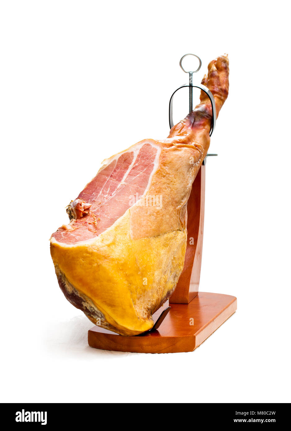 Whole jamon on a wooden stand isolated on white background Stock Photo ...