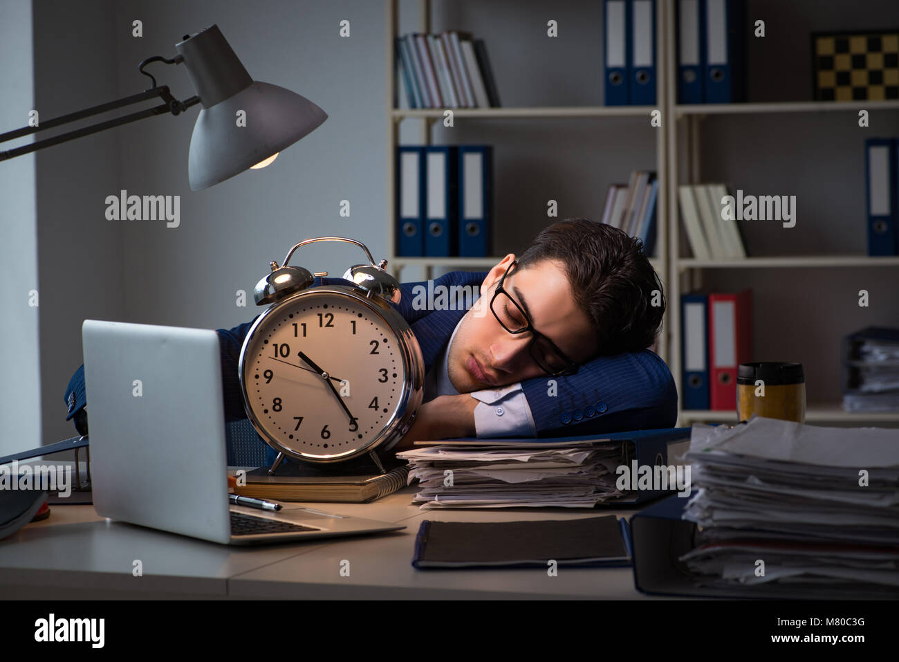 Businessman falling asleep during long hours in office Stock Photo - Alamy