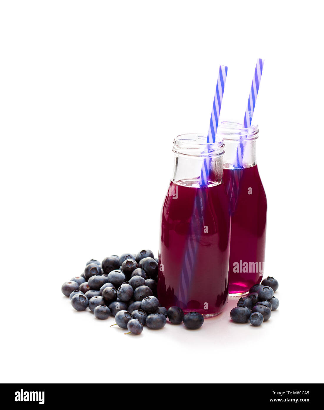 Blueberry juice in glass bottles Stock Photo - Alamy