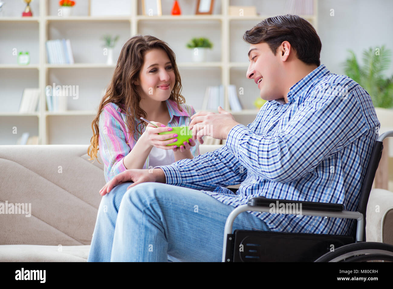 Young family taking care of each other Stock Photo - Alamy