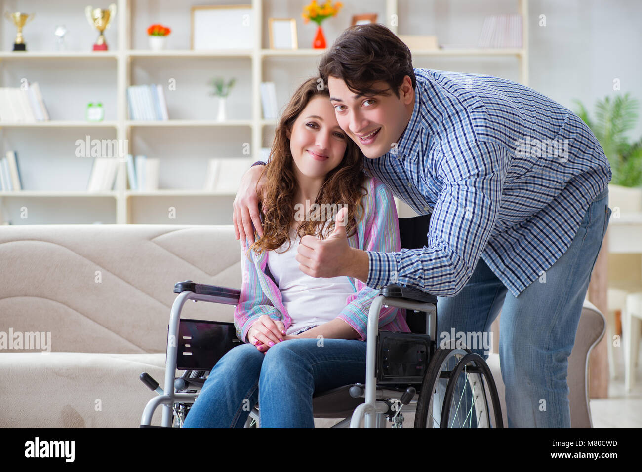Young family taking care of each other Stock Photo - Alamy