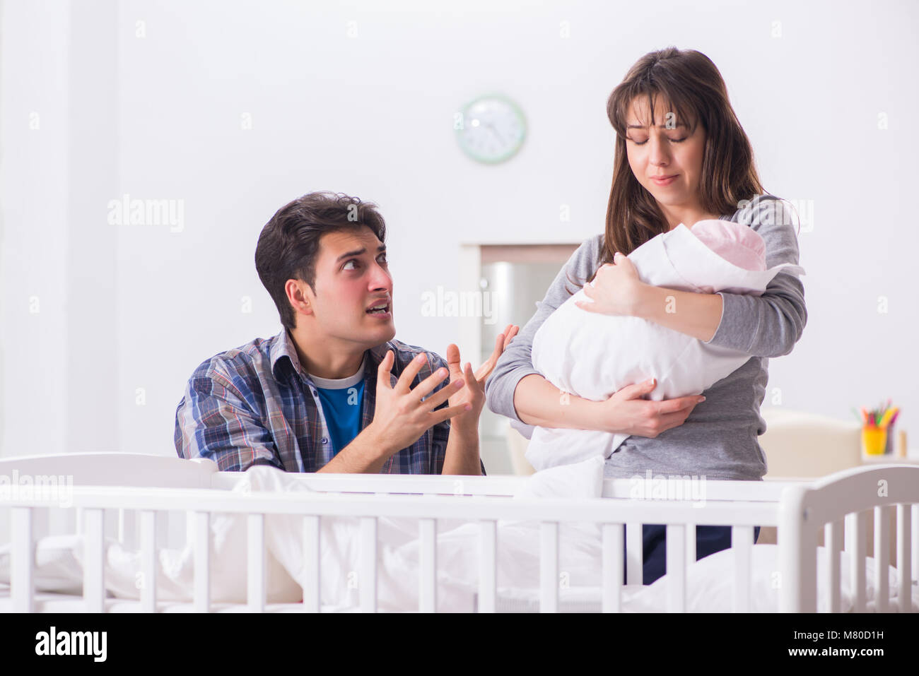 Young dad cannot stand baby crying Stock Photo - Alamy