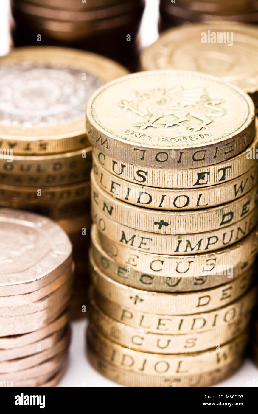 British coin stacks on a white background Stock Photo - Alamy