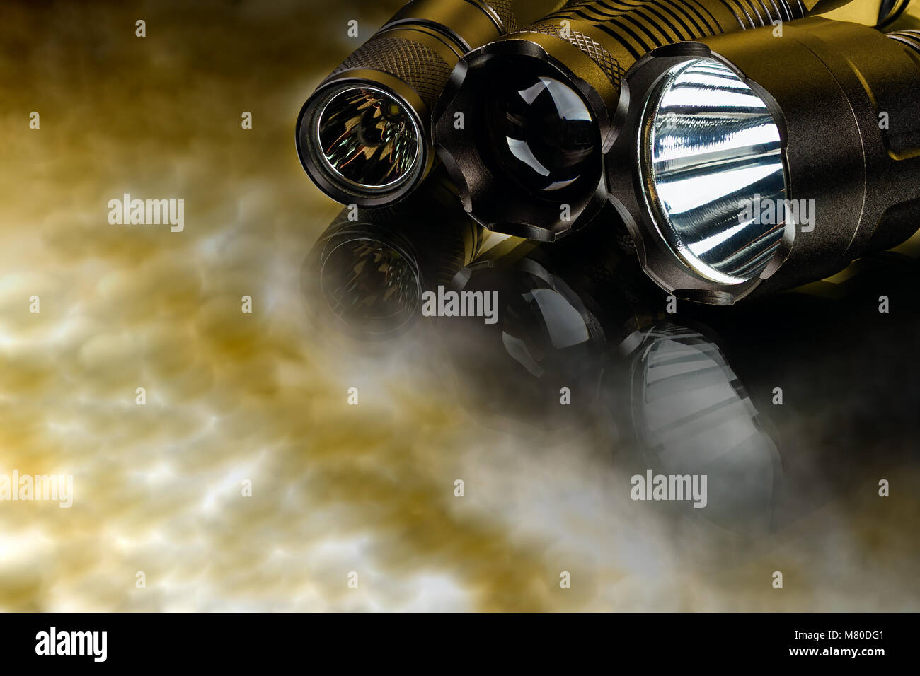 black anodized aluminium waterproof tactical flashlight on dark ...