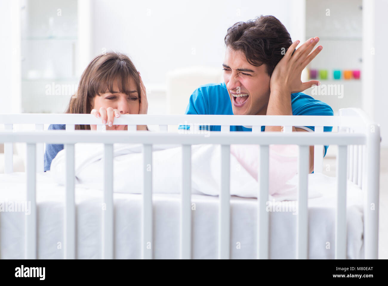Young family frustrated at baby crying Stock Photo - Alamy