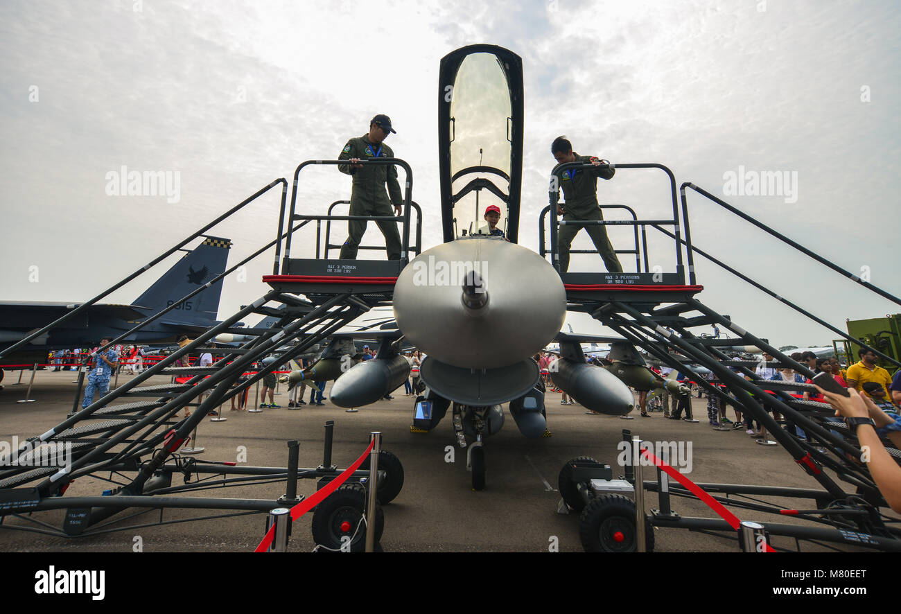 Singapore - Feb 10, 2018. Soldiers standing on cockpit of a Lockheed ...