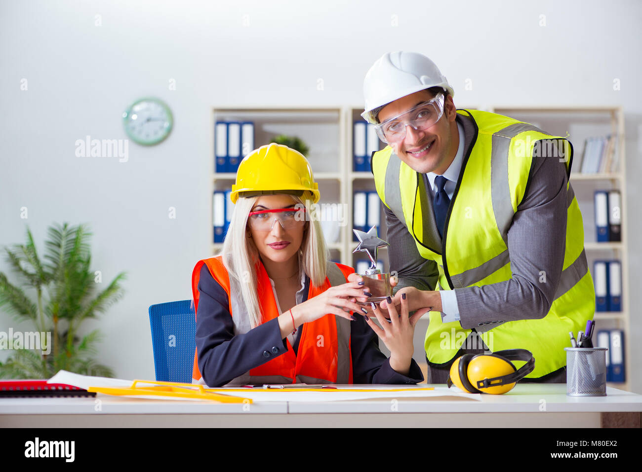 Construction workers having discussion in office before starting ...