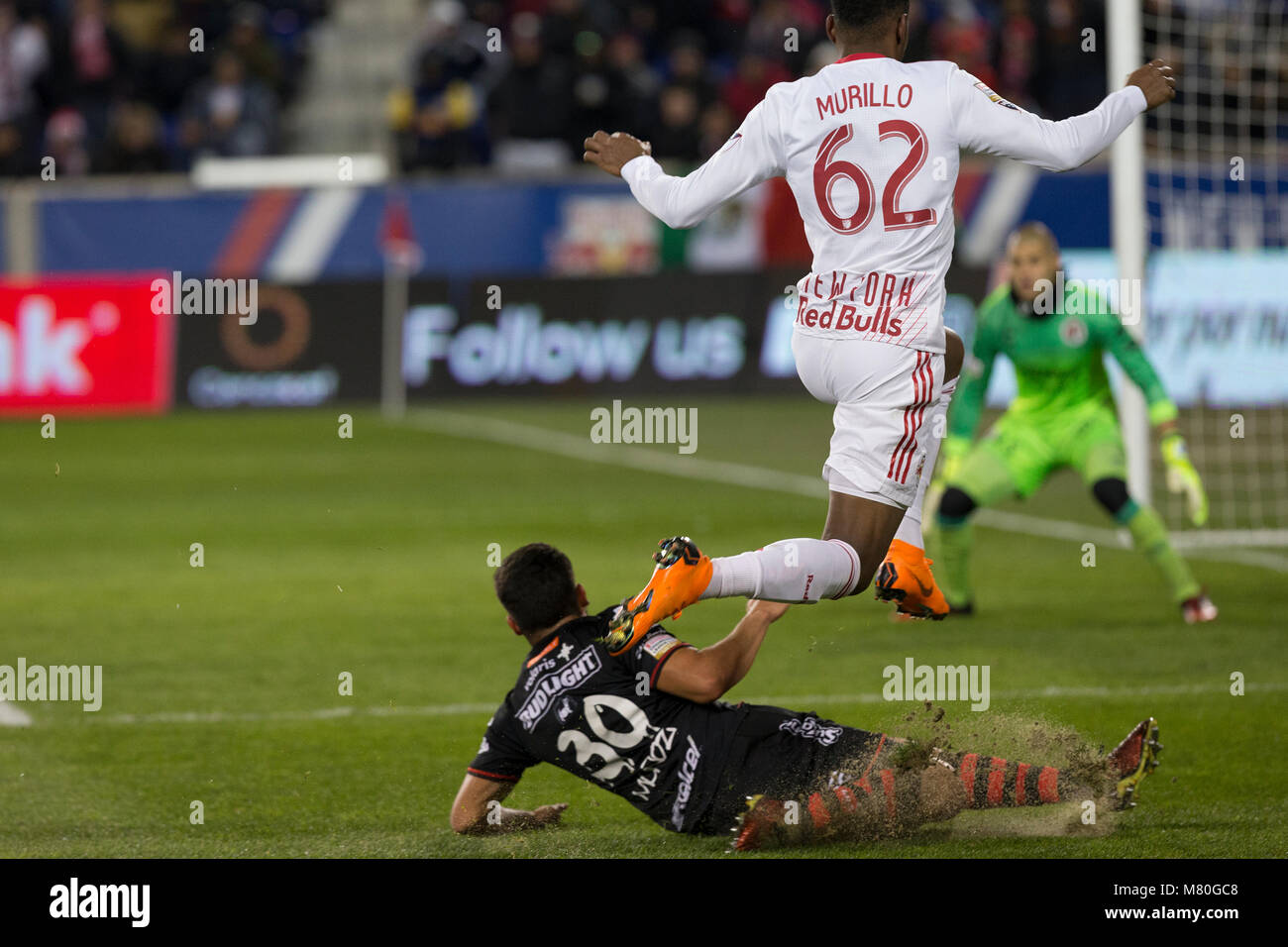 Michael Murillo (62) of Red Bulls & Hiram Munoz (30) of Club Tijuana ...