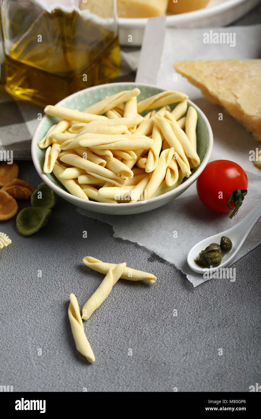 Raw pasta in small bowl, food closeup Stock Photo - Alamy