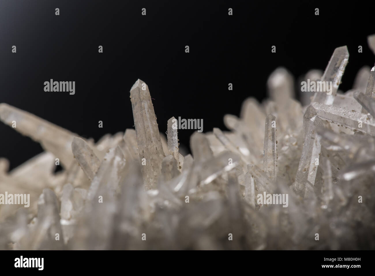 Pure Quartz Crystal cluster on black background Stock Photo - Alamy