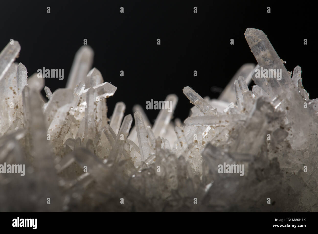 Pure Quartz Crystal cluster on black background Stock Photo - Alamy