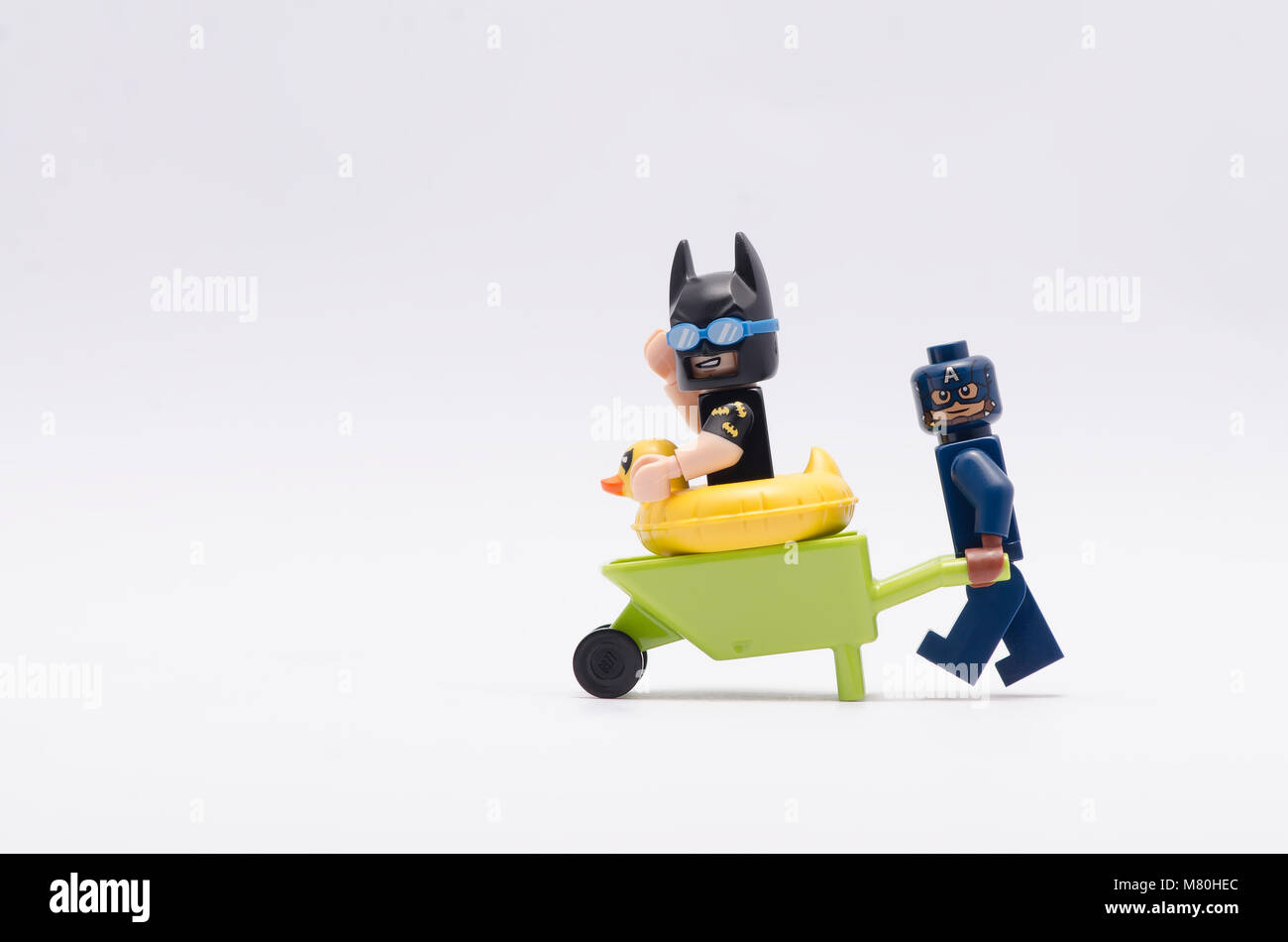 lego vacation batman sitting on wheelbarrow and captain america push ...