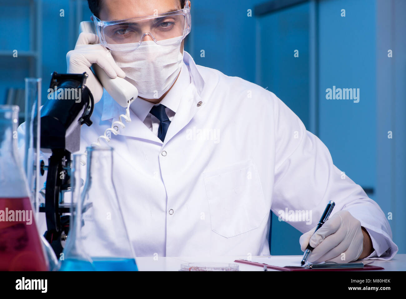 Chemistry assistant working in the chemical lab Stock Photo - Alamy