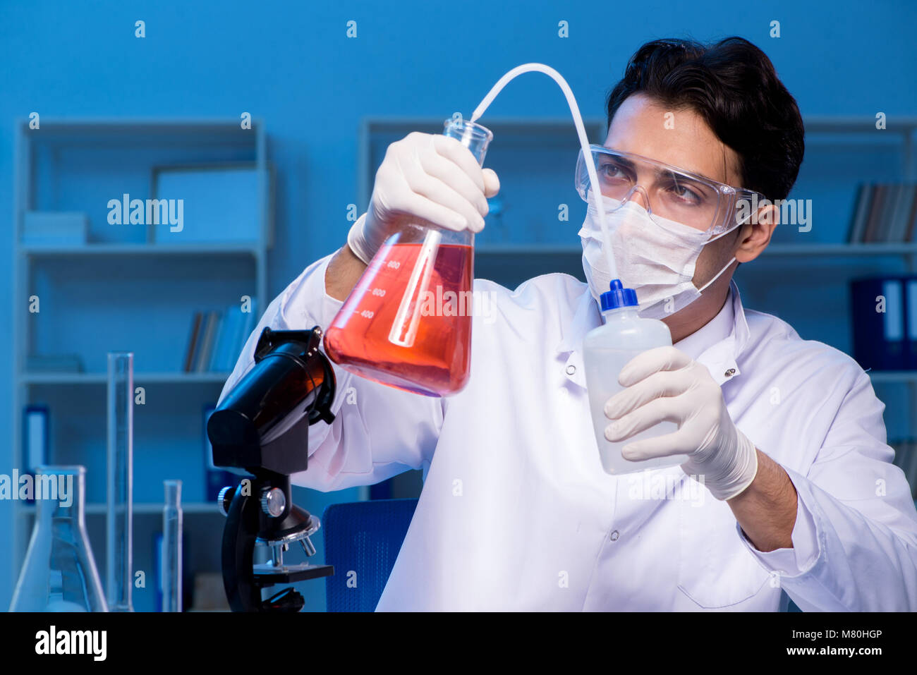 Chemistry assistant working in the chemical lab Stock Photo - Alamy