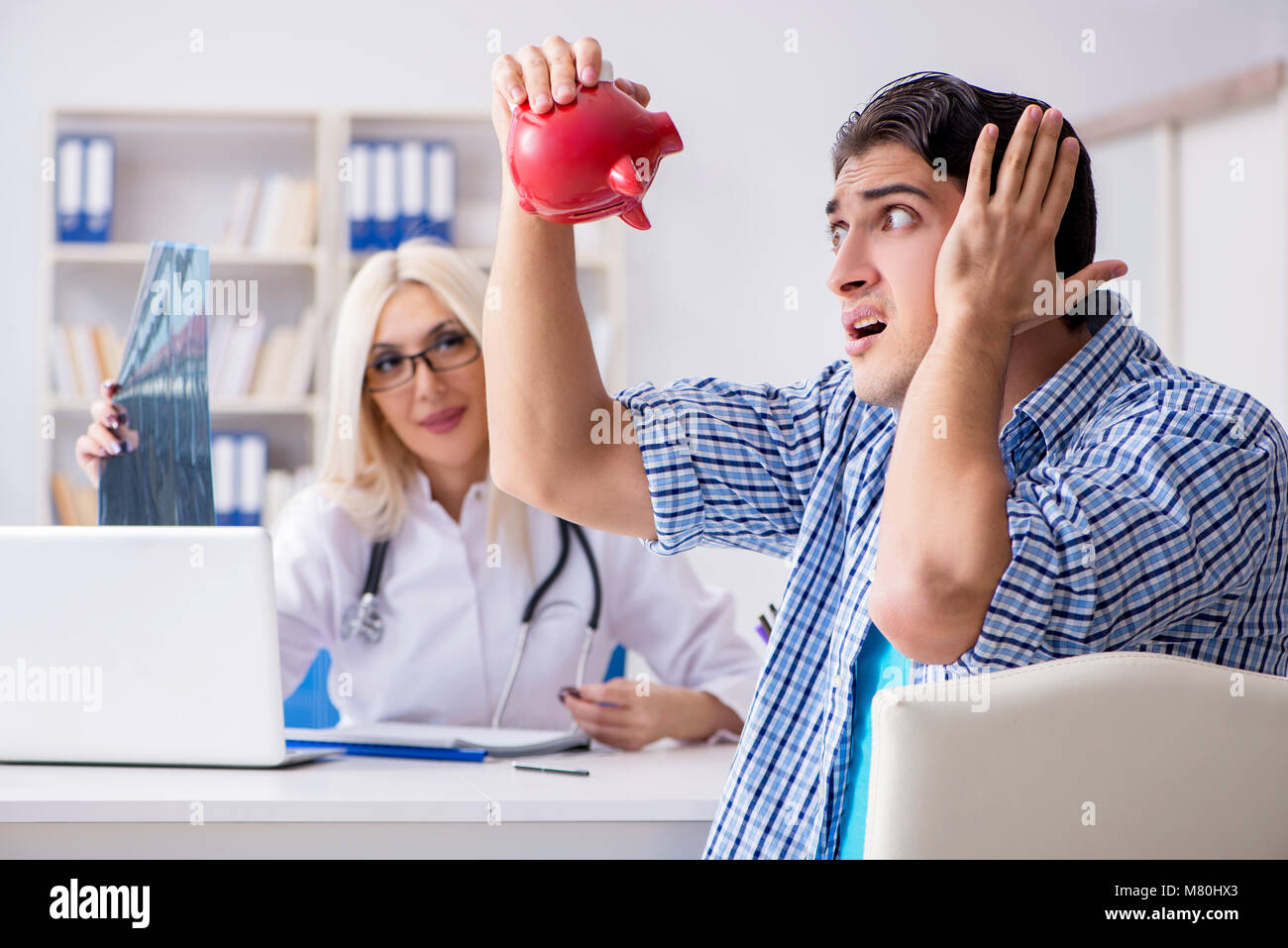 Male patient angry at expensive healthcare bill Stock Photo - Alamy