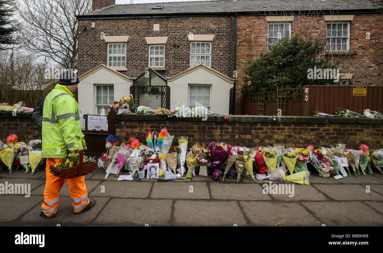 Floral tributes grow outside the home of Liverpool comedian Sir Ken ...