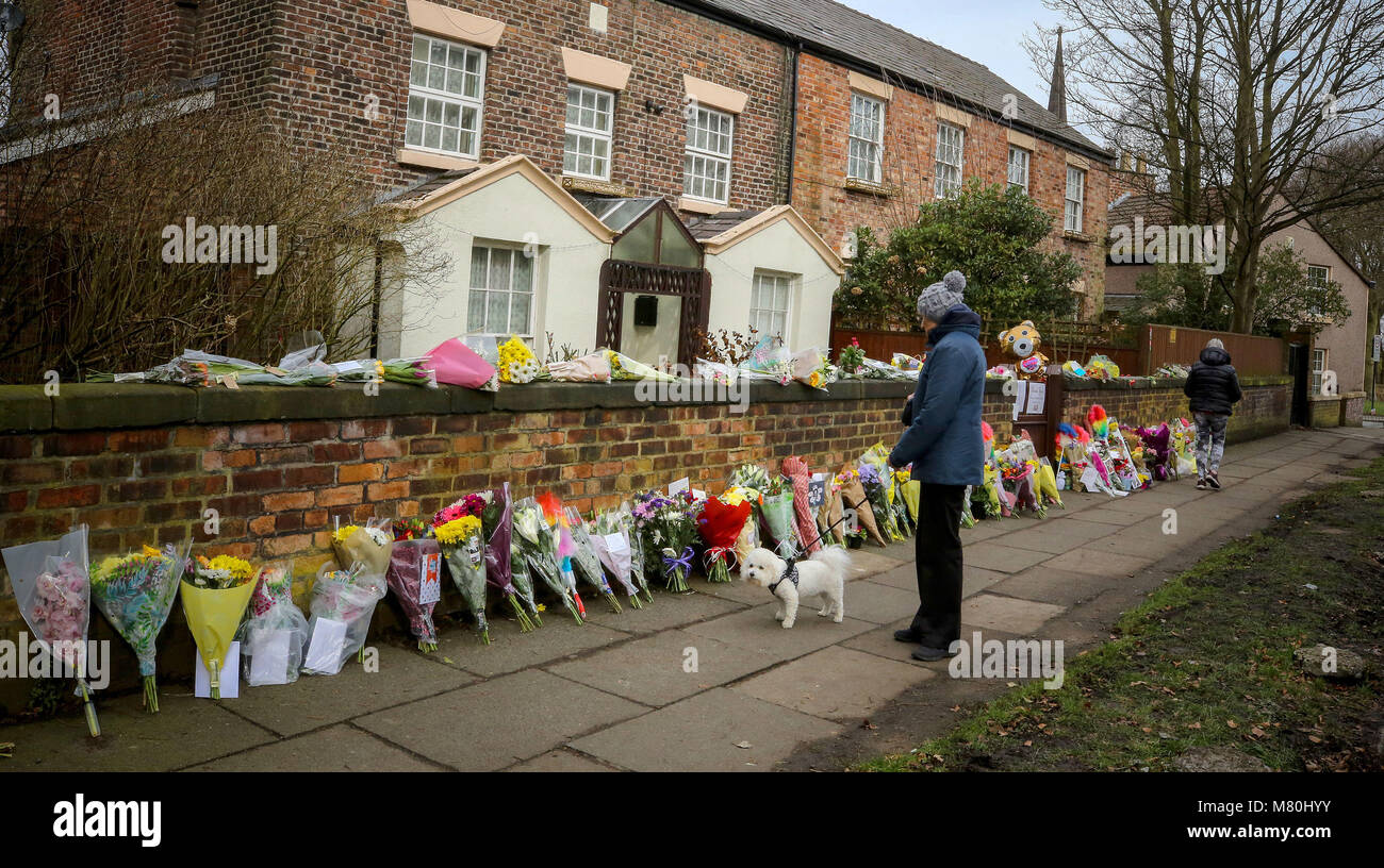 Floral tributes grow outside the home of Liverpool comedian Sir Ken ...