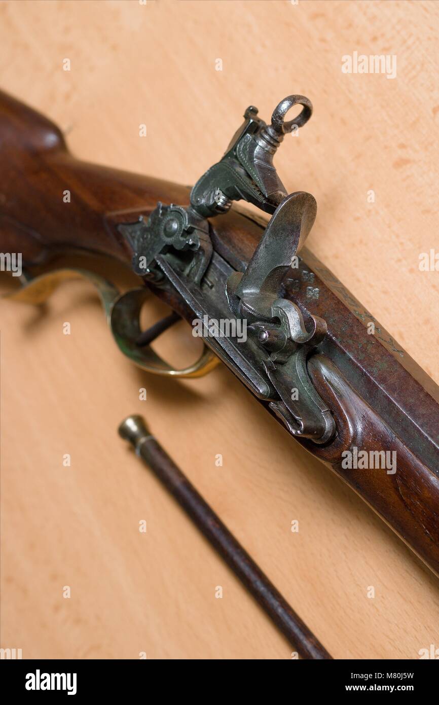 Trigger and flintlock of antique weapon Stock Photo - Alamy