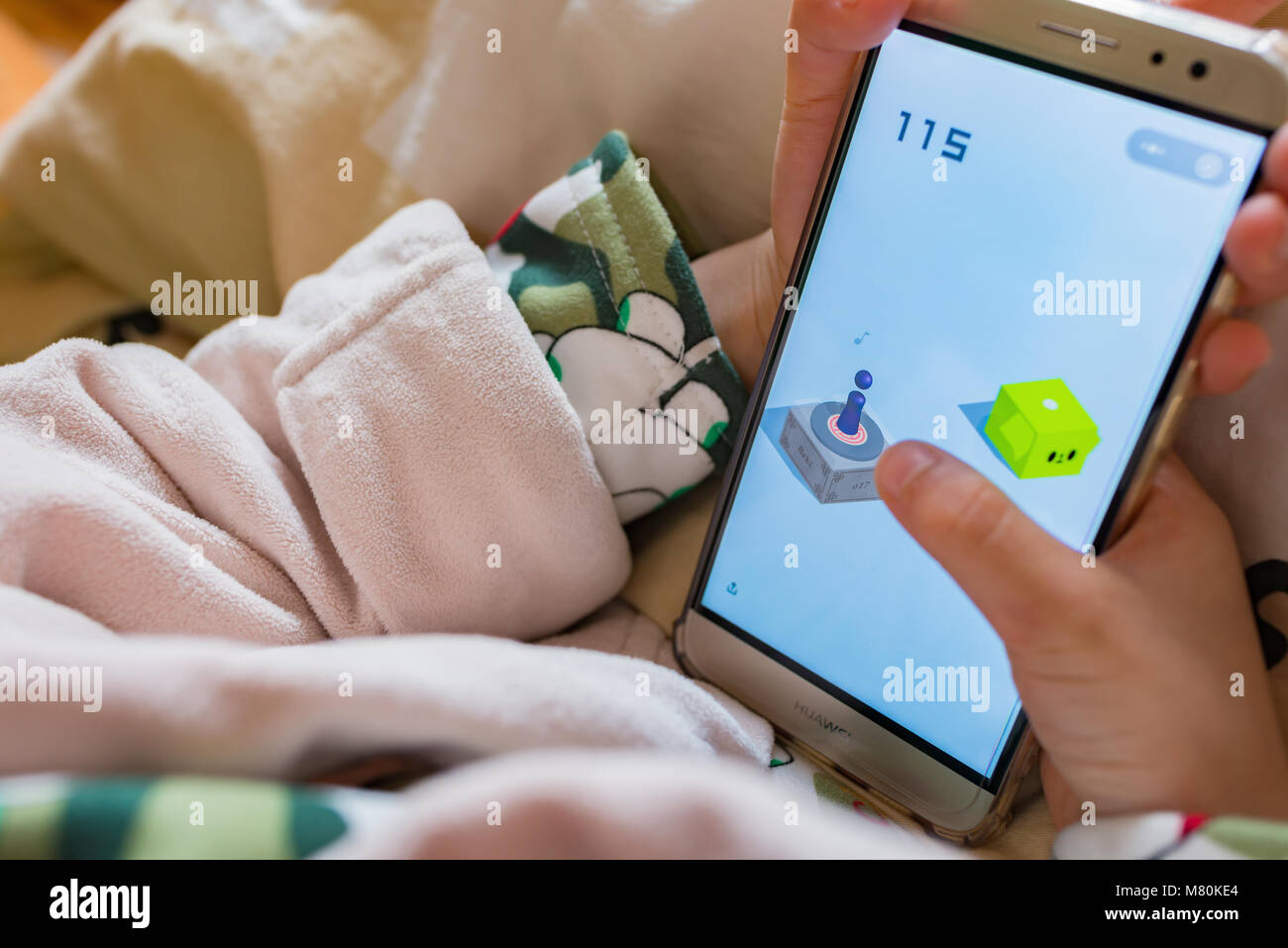 Zhongshan,China-February 15,2018:kid playing a mobile game called ...