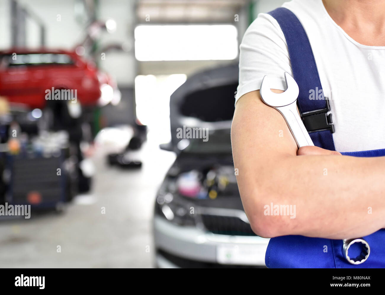 closeup car mechanic in workshop with tool Stock Photo - Alamy