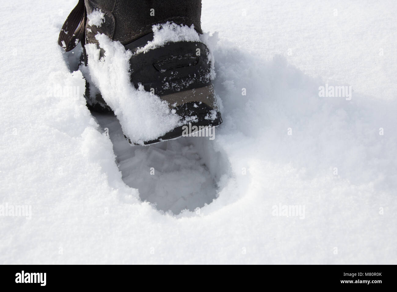 footstep from hiking boot in a fresh snow Stock Photo - Alamy