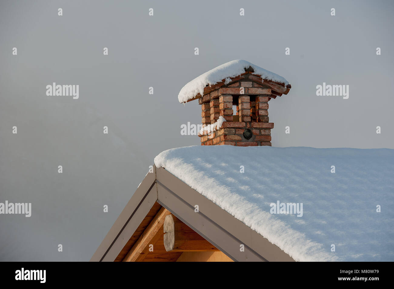 chimney pot on a snow-covered roof Stock Photo - Alamy