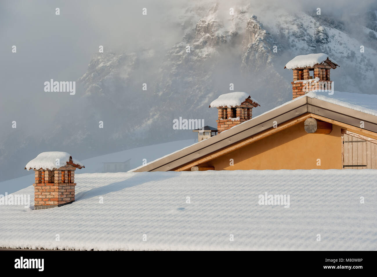 chimney pot on a snow-covered roof Stock Photo - Alamy