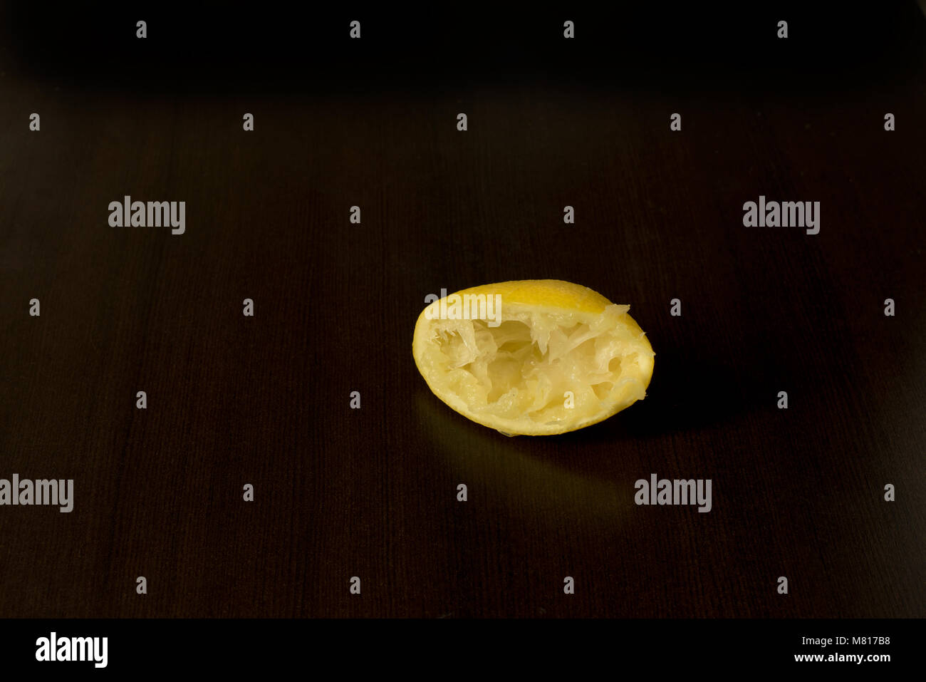 Squeezed lemon skin on dark background - lemon peel - dark food ...