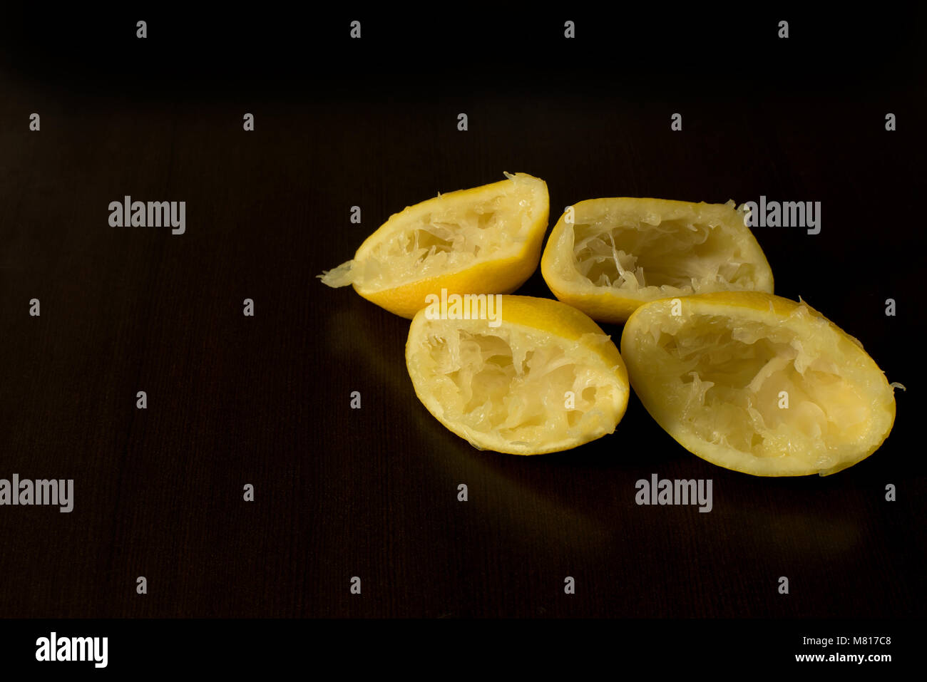 Squeezed lemon skins on dark background - lemon peel - dark food ...