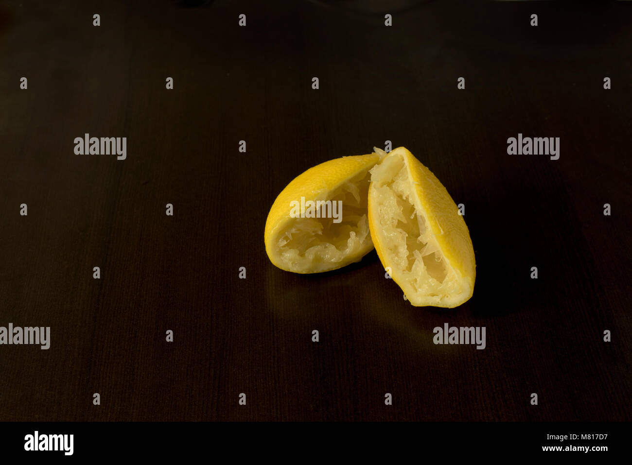Squeezed lemon skin on dark background - lemon peel - dark food ...