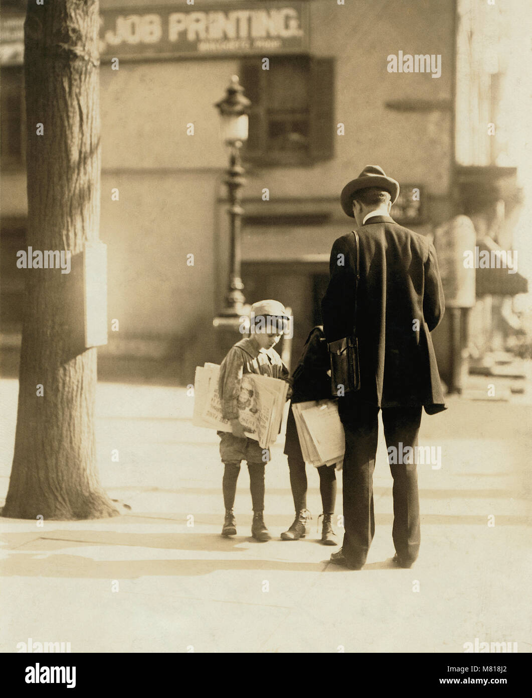 Young boy selling newspapers hi-res stock photography and images - Alamy