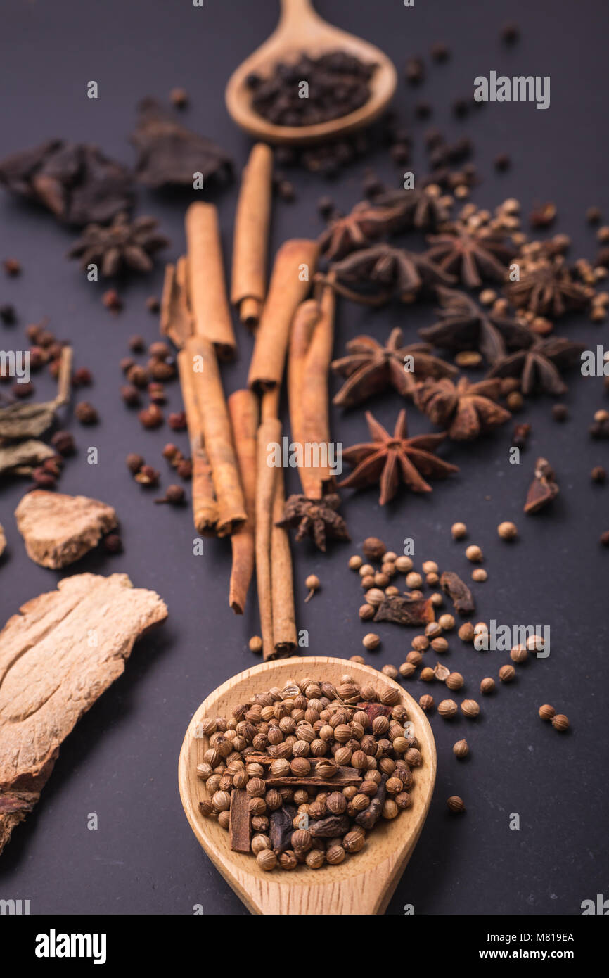 Mix of dried spices and herb on black stone table. Top view Stock Photo ...
