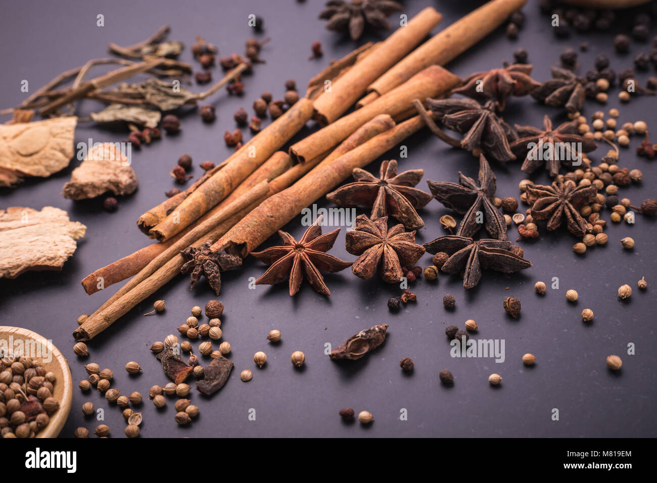 Mix of dried spices and herb on black stone table. Top view Stock Photo ...