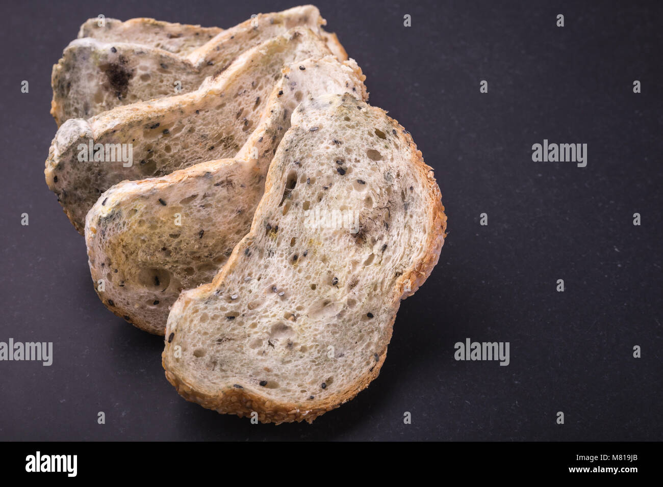 Mold on bread put on black stone table background. Top view Stock Photo ...