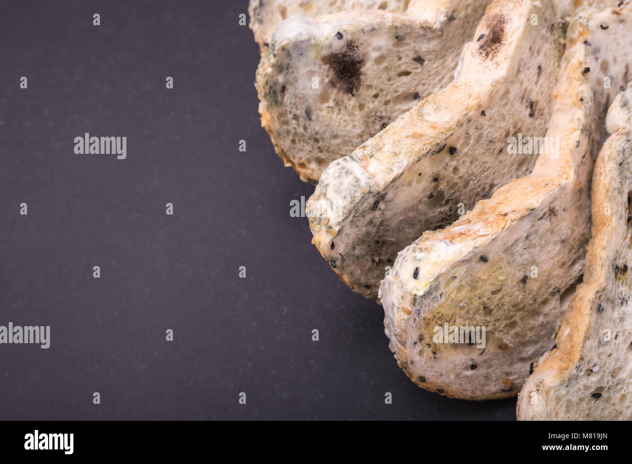 Mold on bread put on black stone table background. Top view Stock Photo ...