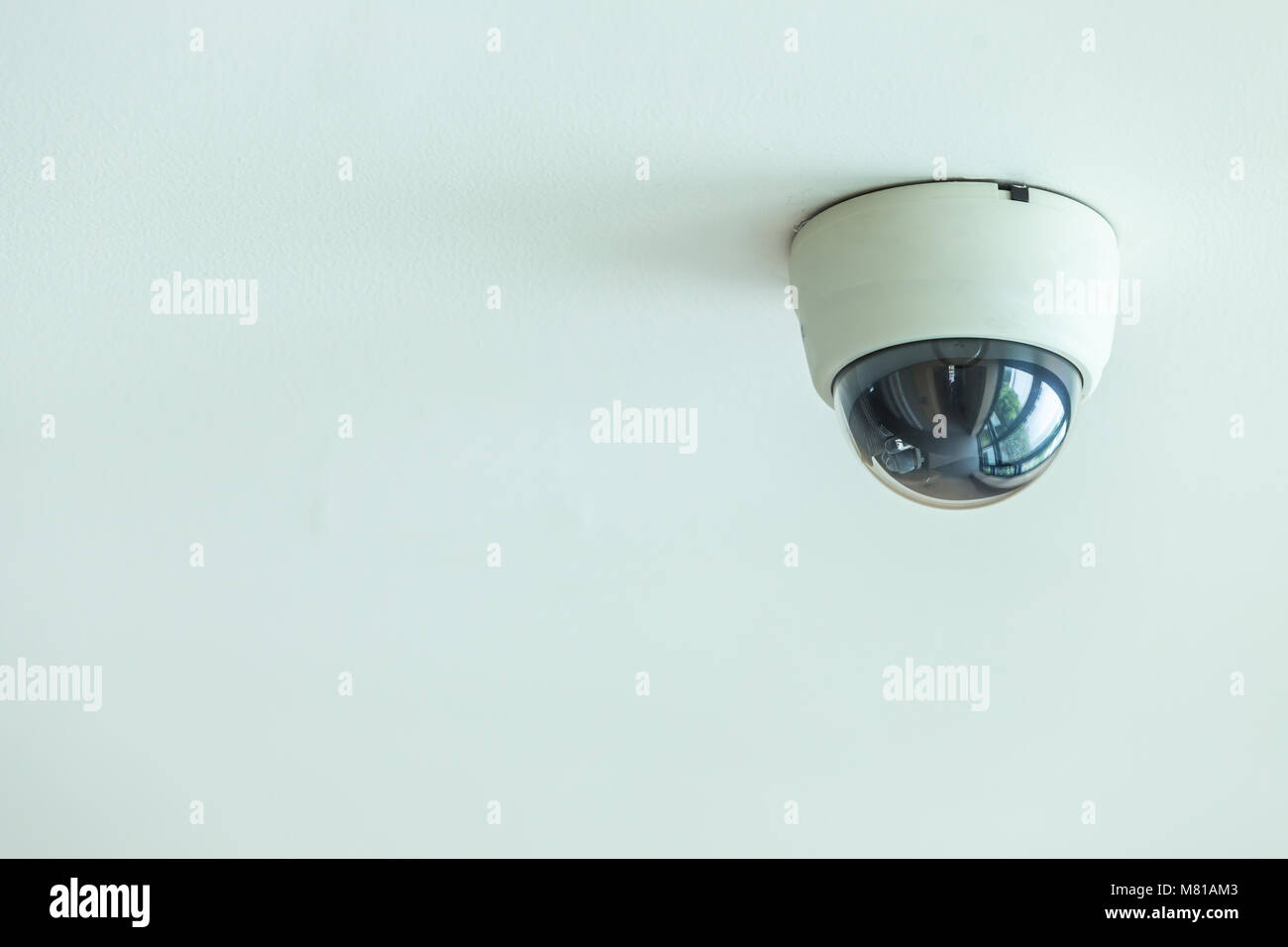 Close up CCTV system installed on the ceiling in the hotel corridor ...