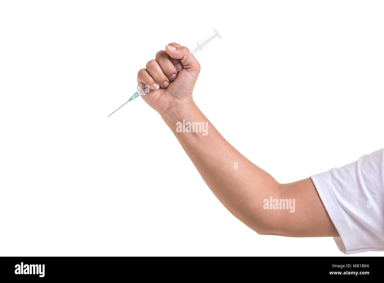 Hand of woman holding syringe. Studio shot isolated on white background ...
