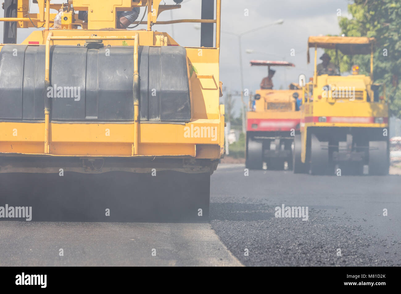 Outdoor working : Road roller working on the new road construction site ...