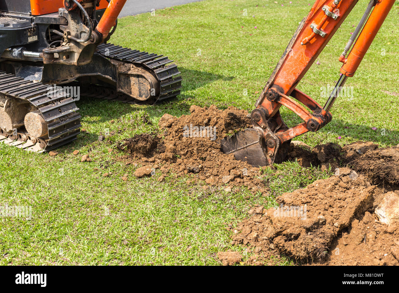 Excavator machine operate for digging soil and repair road in the ...