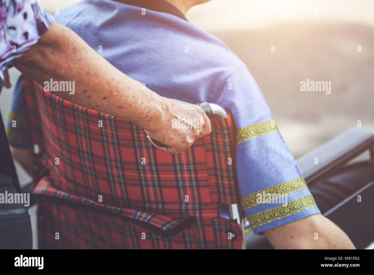 Close up hand of old people on wheelchair of disabled people Stock ...