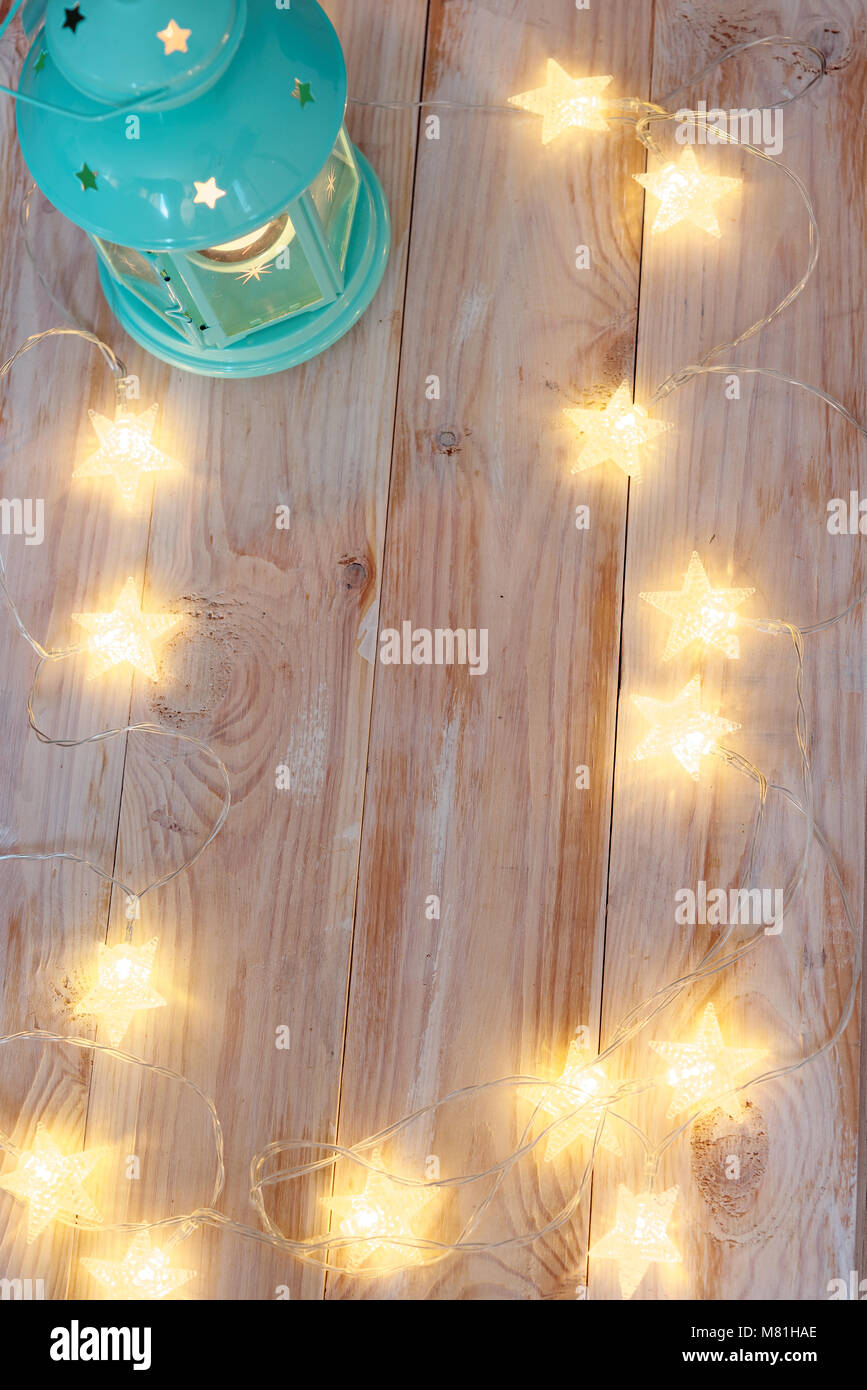 Christmas frame with illuminated festoon and lantern Stock Photo - Alamy