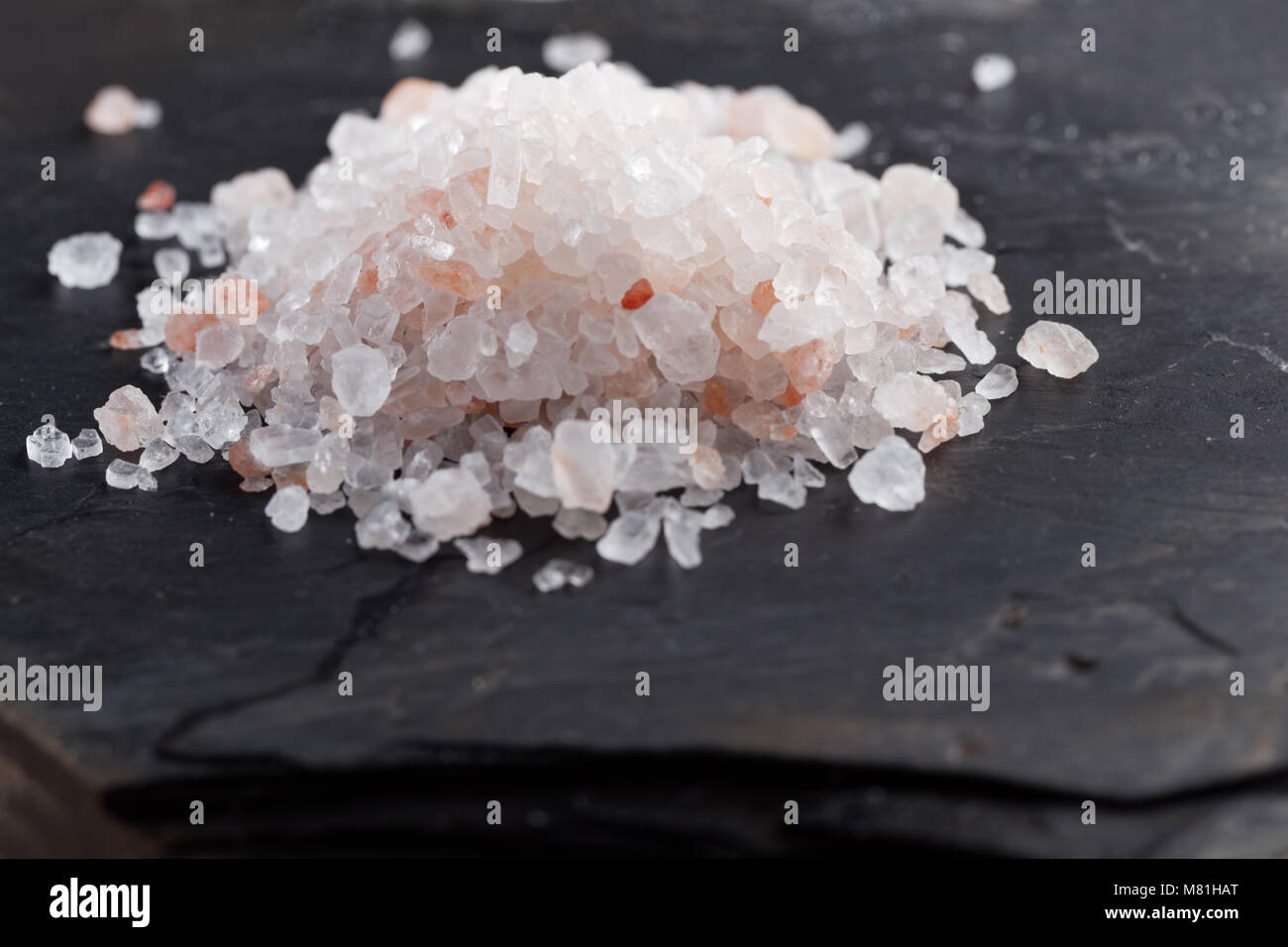 Heap of sea salt on a slate surface Stock Photo - Alamy