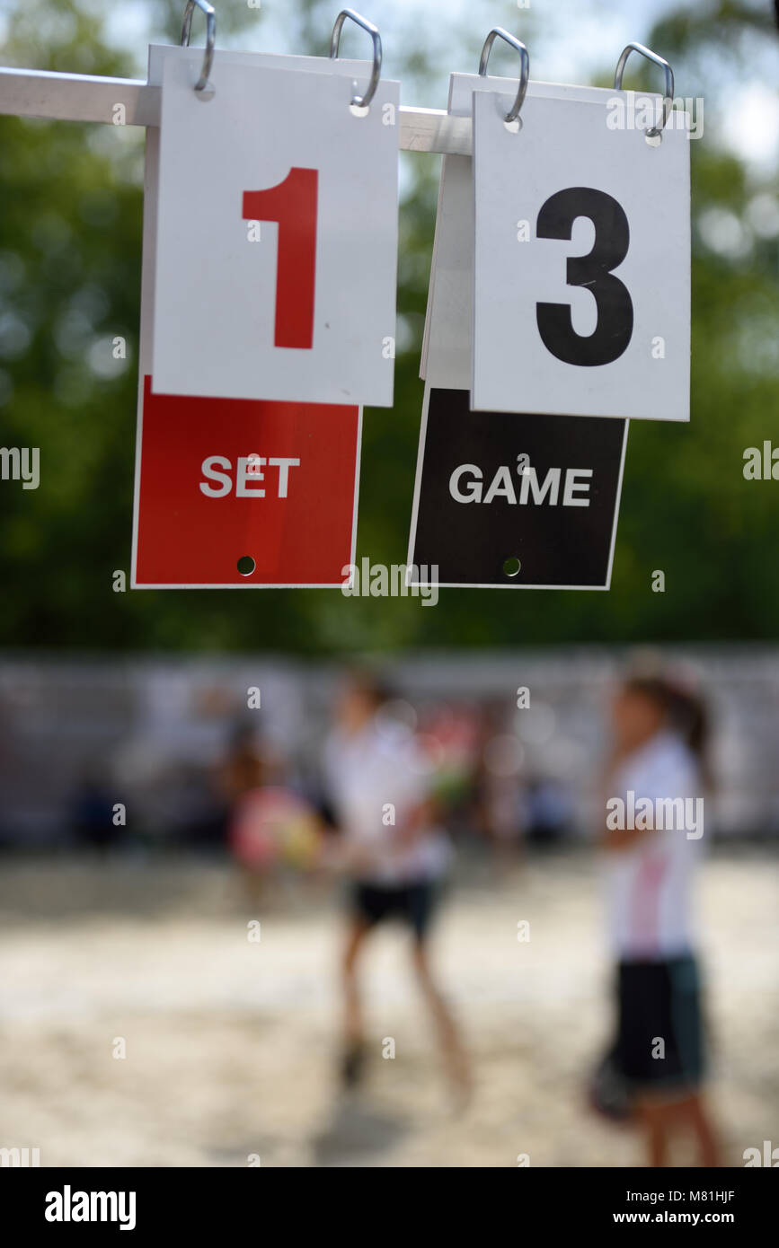 Scoreboard against the people playing beach tennis Stock Photo - Alamy