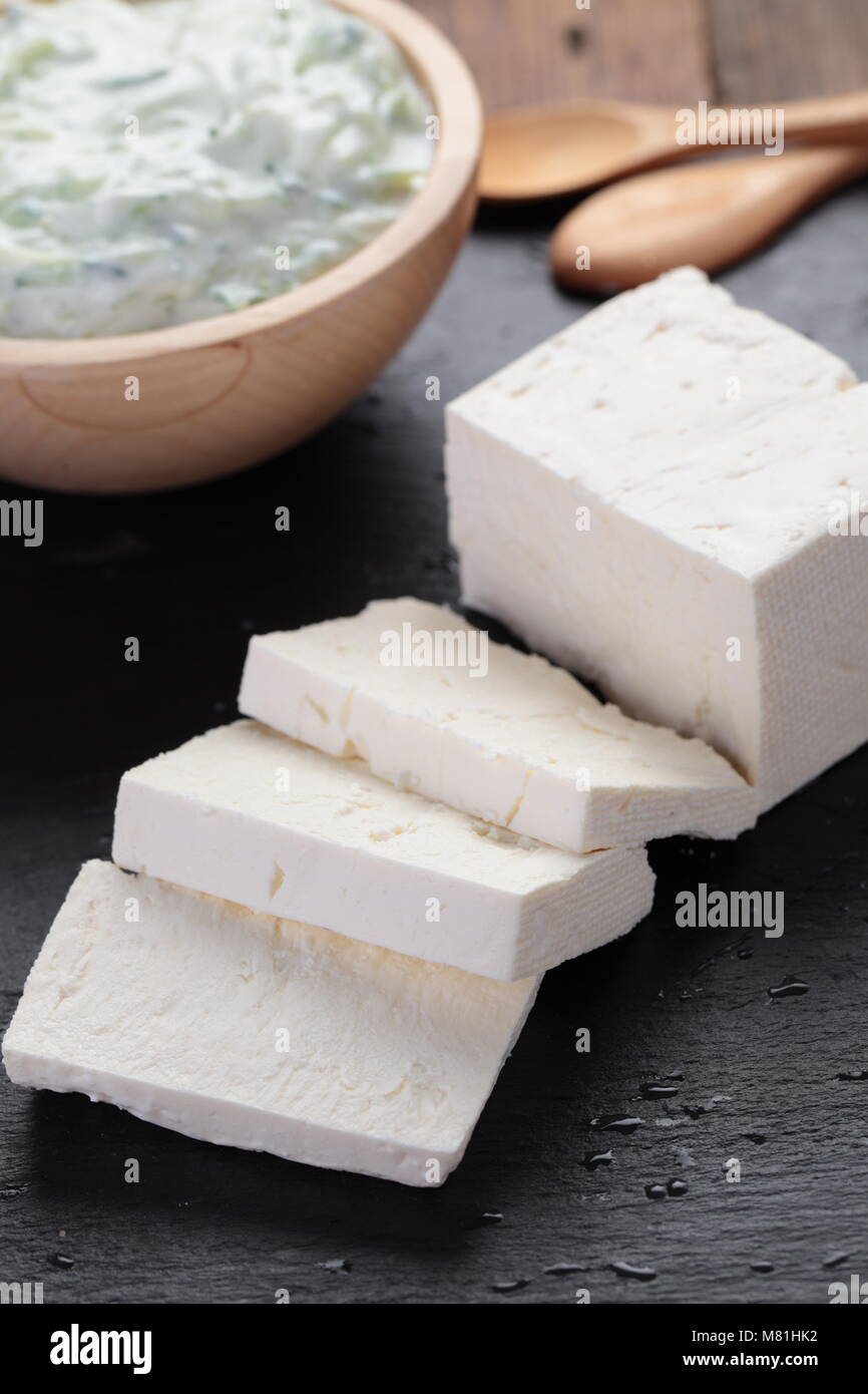 Sliced feta cheese on a slate surface Stock Photo - Alamy