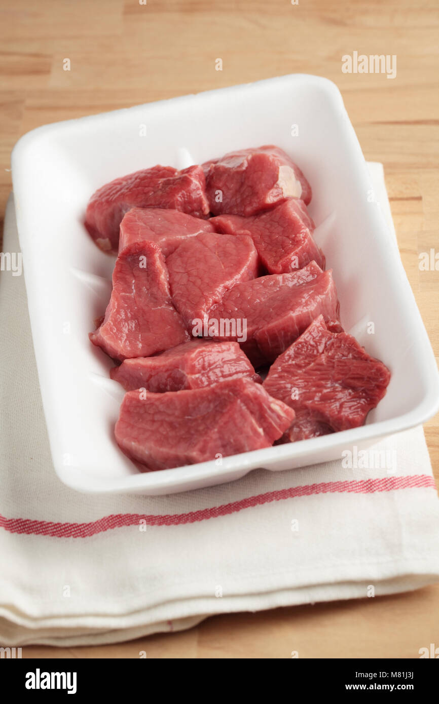Raw meat in a disposable tray Stock Photo - Alamy