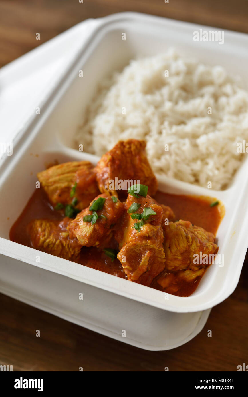 Chicken curry with rice in a disposable container Stock Photo - Alamy