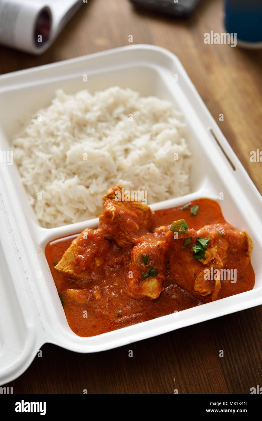 Chicken curry with rice in a disposable container Stock Photo - Alamy