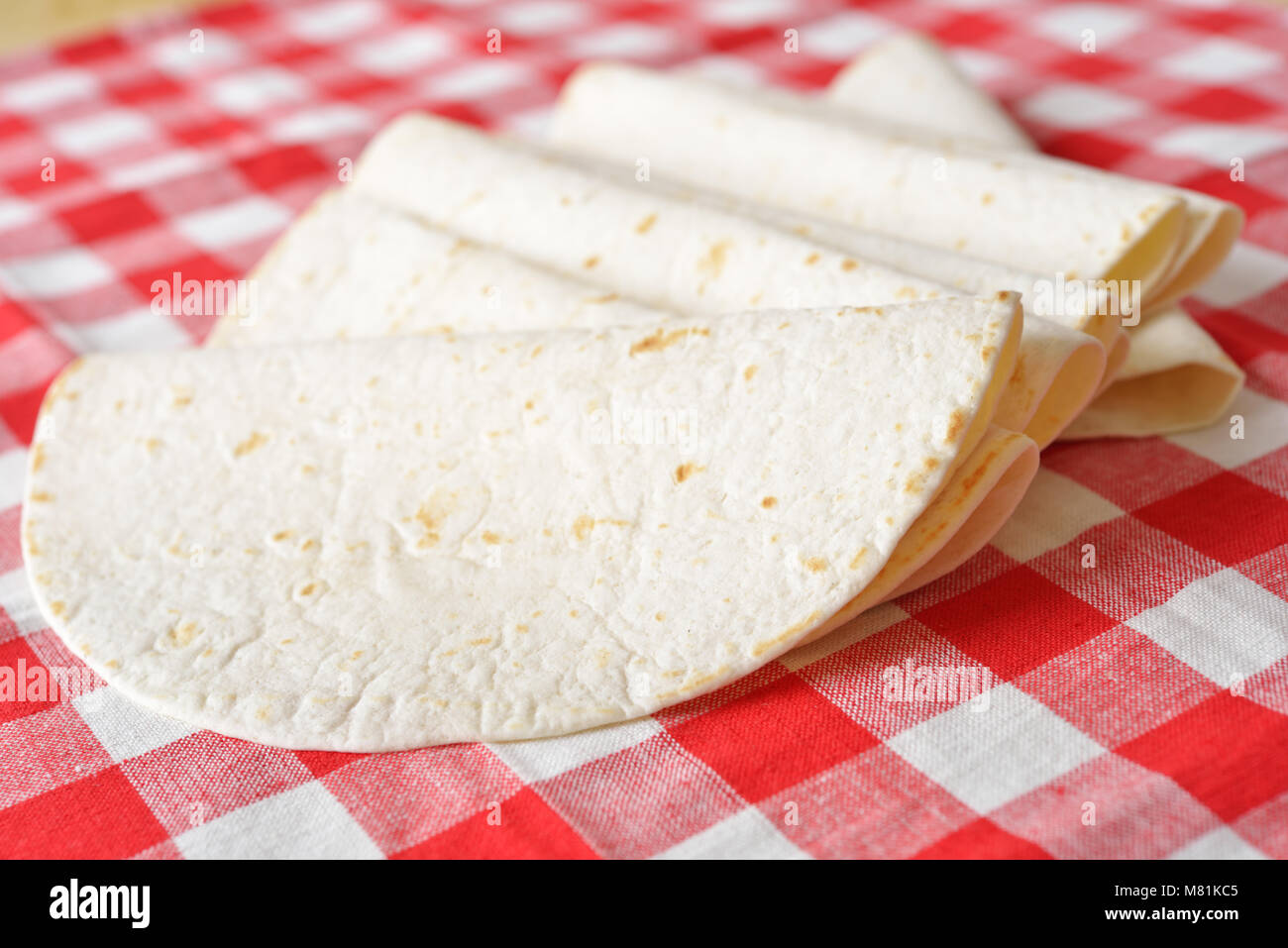Folded tortillas on a table Stock Photo - Alamy