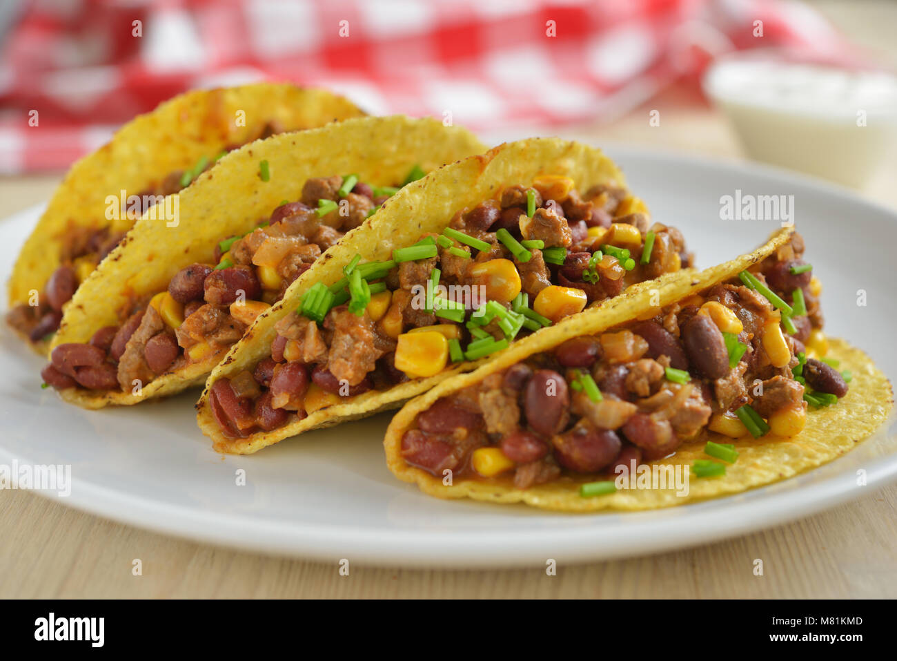 Four tacos with chili con carne Stock Photo - Alamy