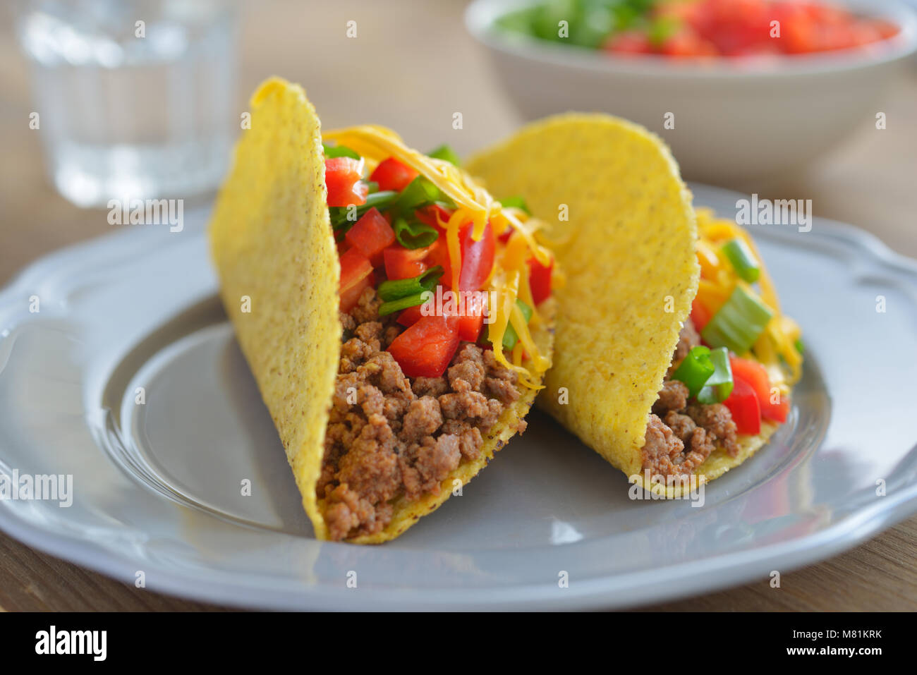 Tacos with ground beef, Cheddar cheese, and vegetables Stock Photo - Alamy